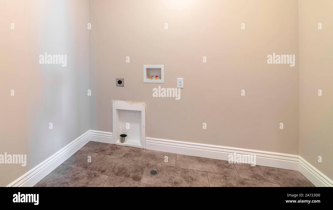 Panorama frame Empty laundry room with water connections empty room ...
