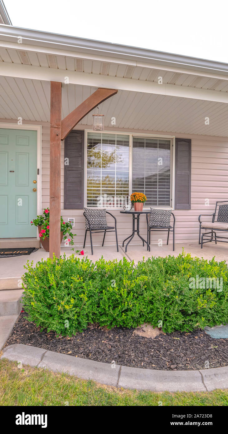Vertical Front veranda of modern home and landscaped garden Stock Photo ...