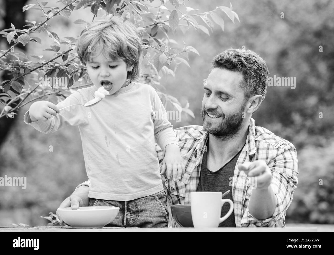 Father son eat food and have fun. Food habits. Little boy with dad ...