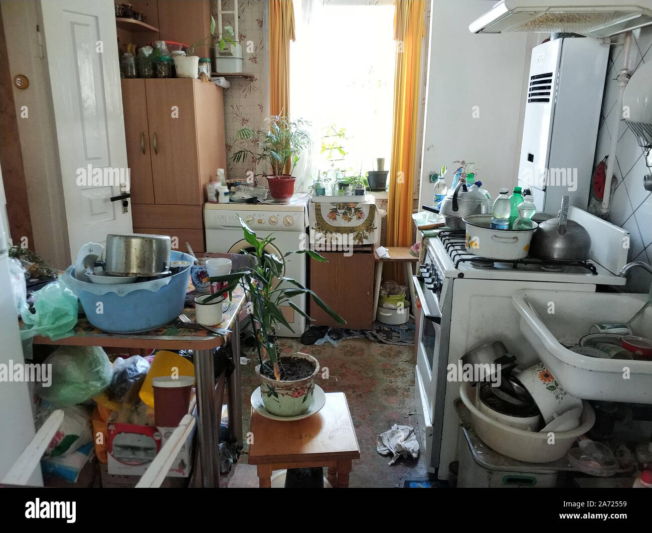 mess and dump. An old room with lots of things. Devastation. Very small ...