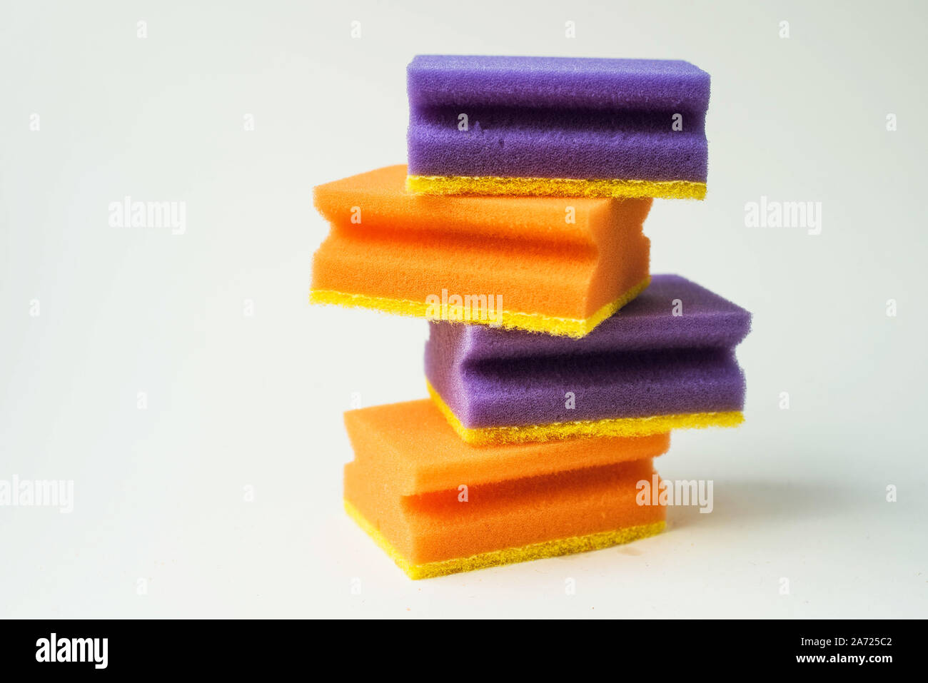 A stack of cleaning sponges on a white background. The concept of ...