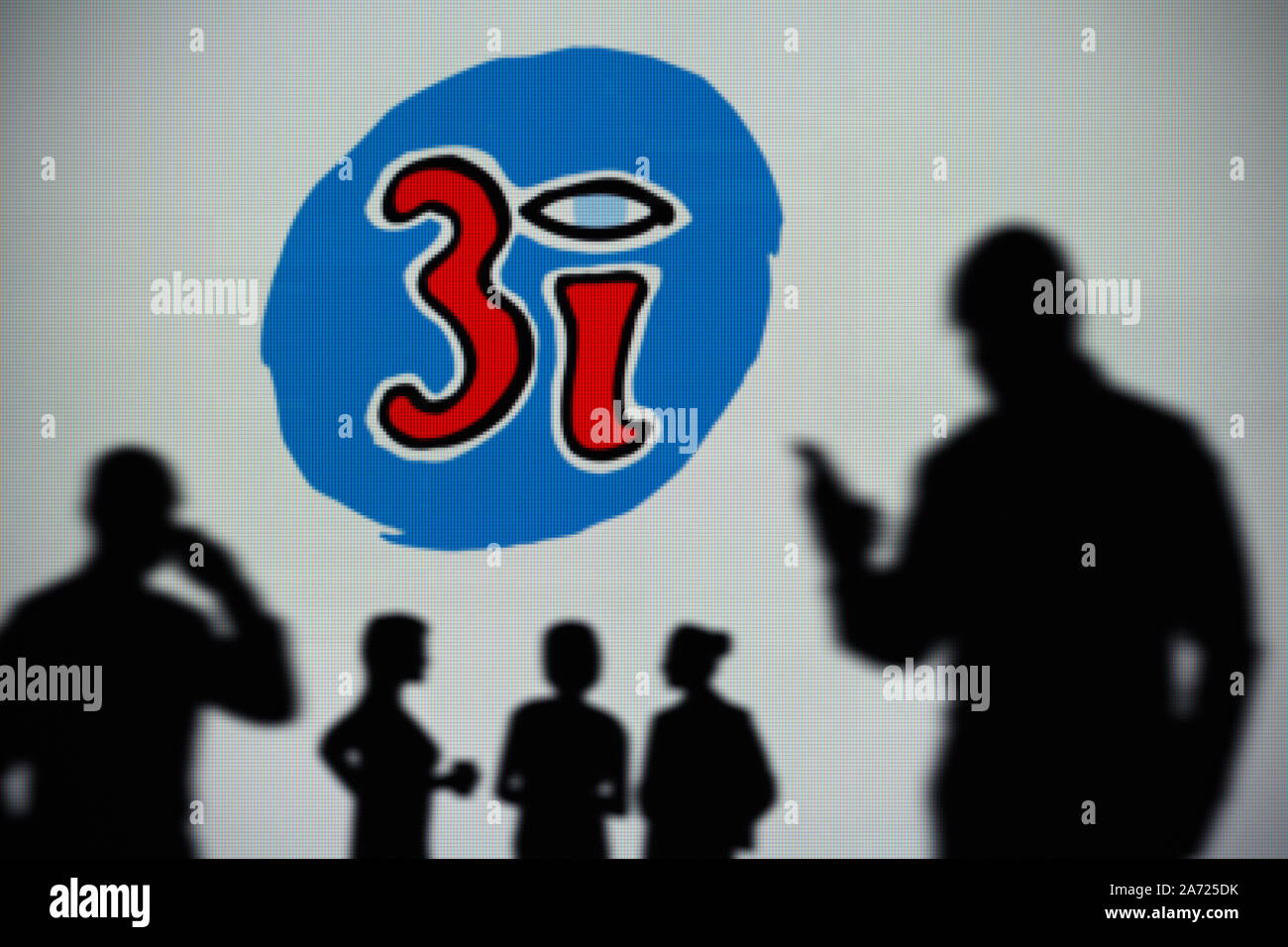 The 3i Group logo is seen on an LED screen in the background while a ...