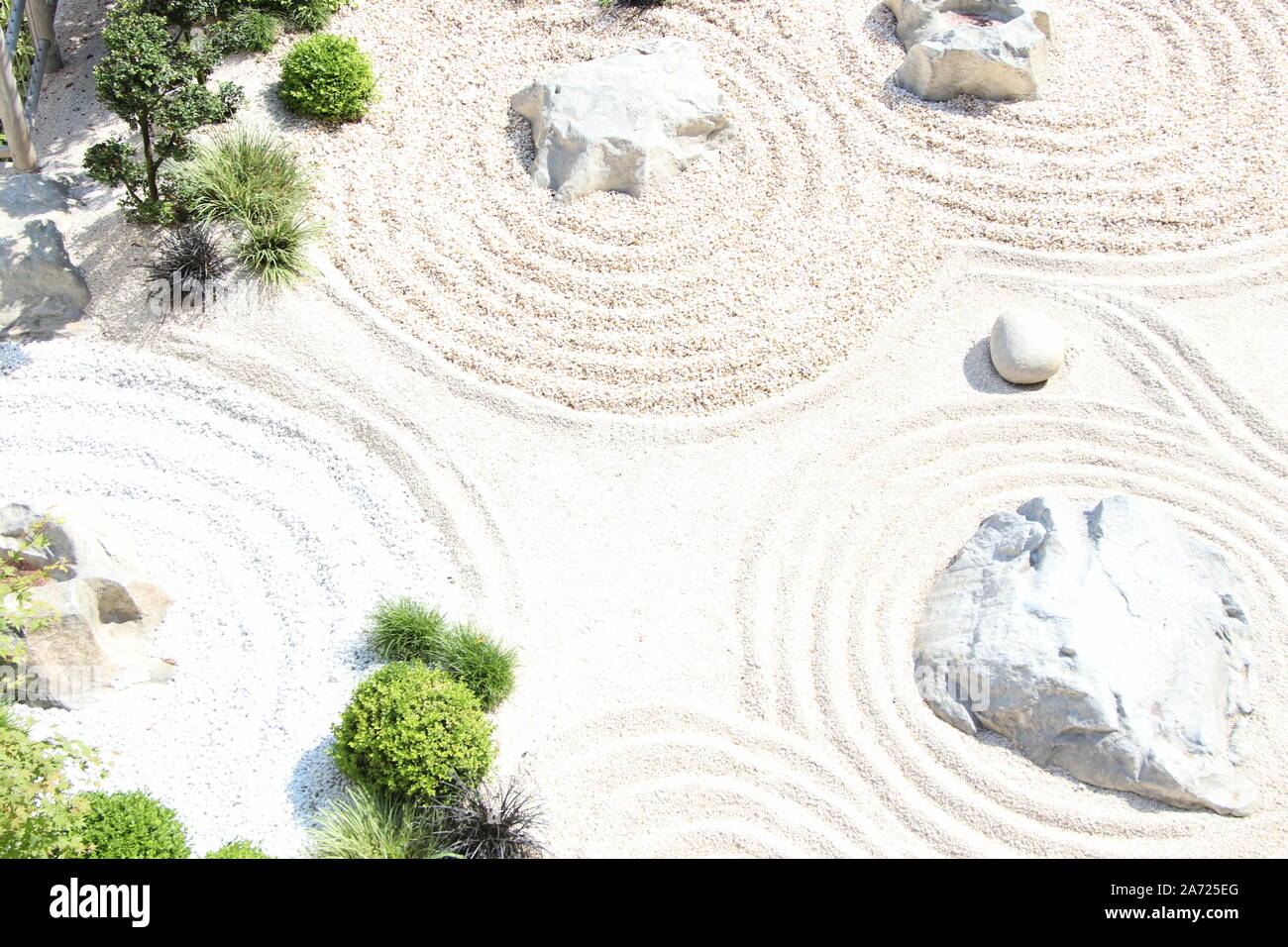 Zen garden pattern on sand and stone. Top view. Meditation and harmony ...