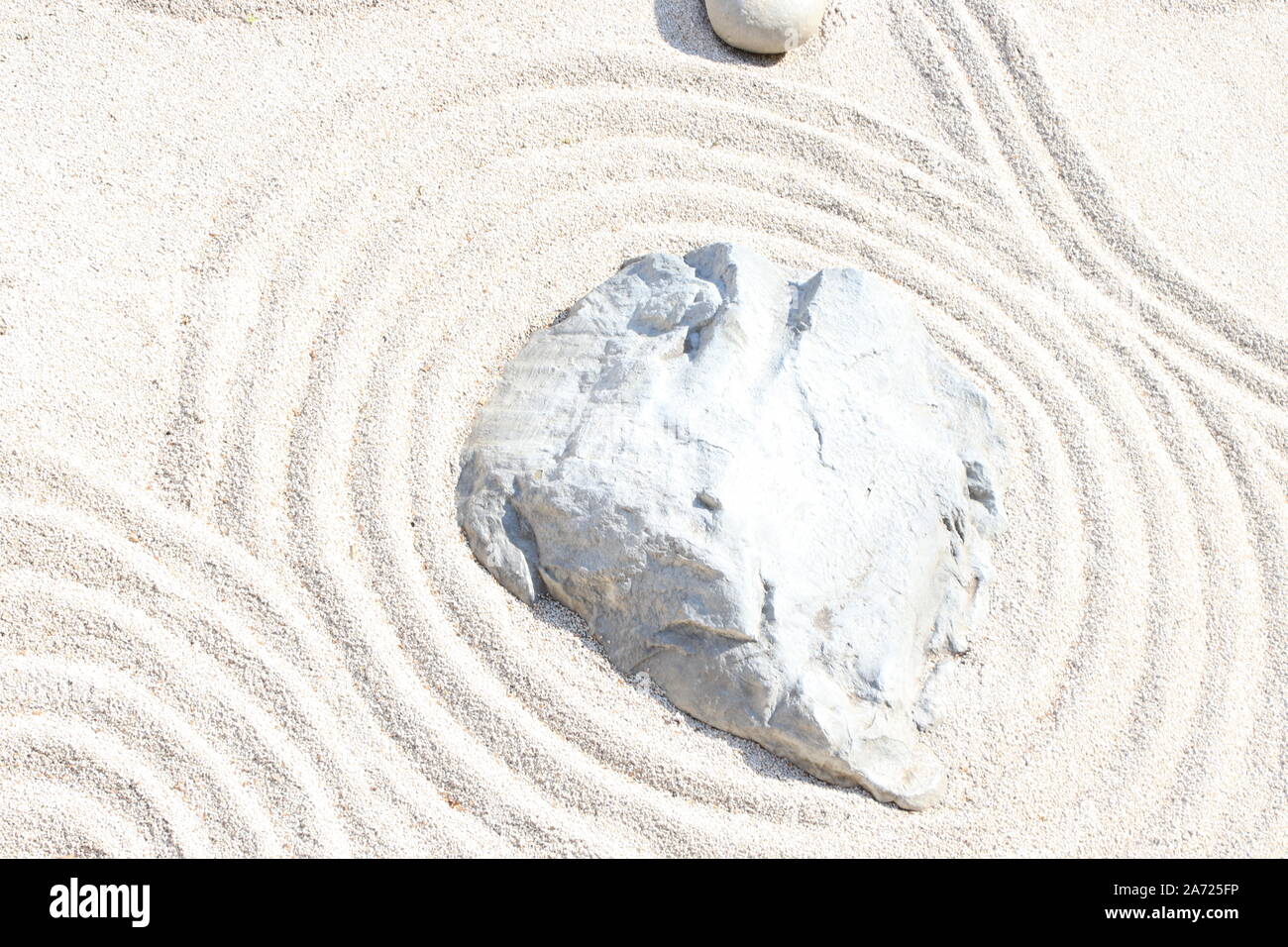 Zen garden pattern on sand and stone. Top view. Meditation and harmony ...