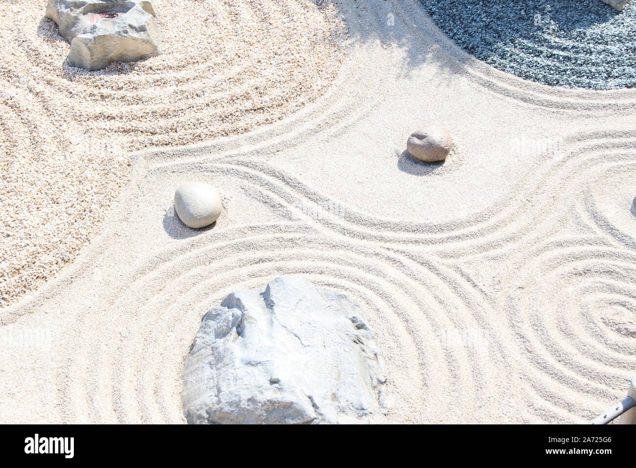 Zen garden pattern on sand and stone. Top view. Meditation and harmony ...