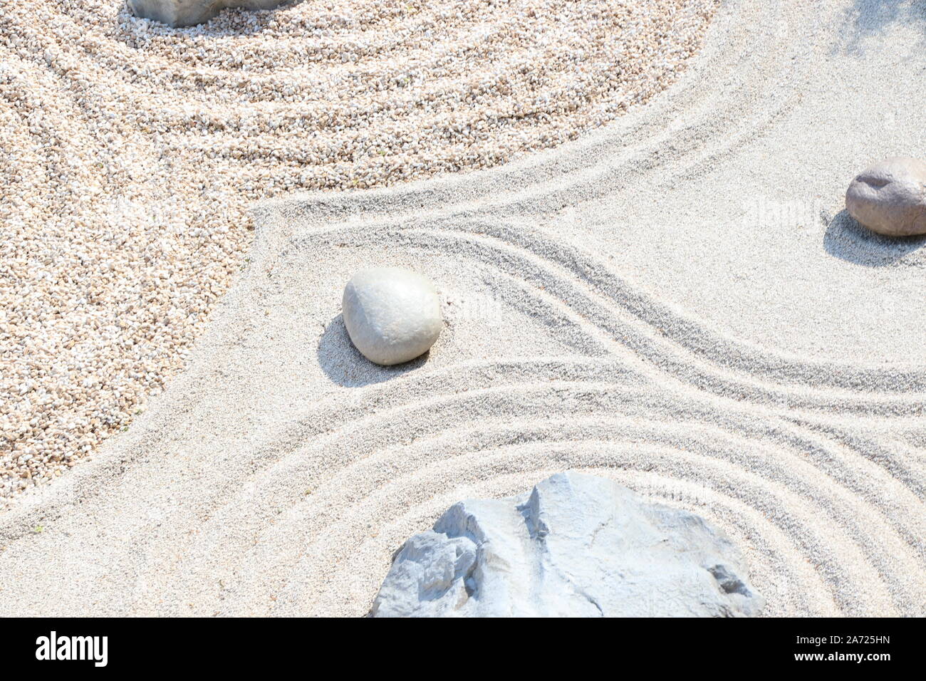 Zen garden pattern on sand and stone. Top view. Meditation and harmony ...