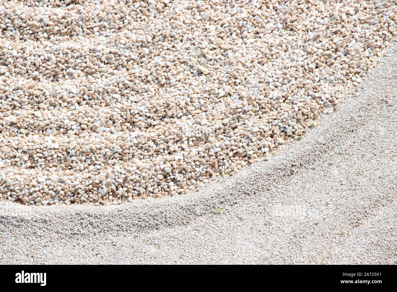 Zen garden pattern on sand and stone. Top view. Meditation and harmony ...
