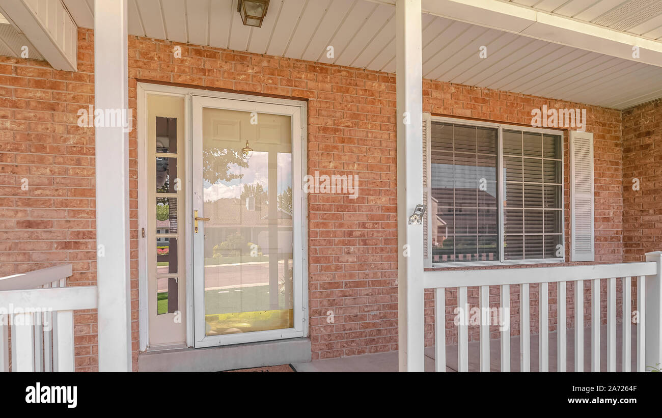Panorama frame Front porch and door of traditional brick home Stock ...