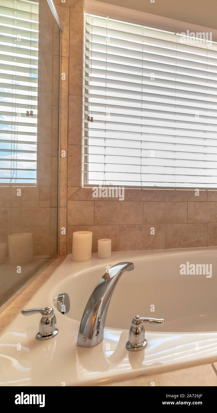 Vertical frame Modern bathroom interior with circular bathtub in front ...