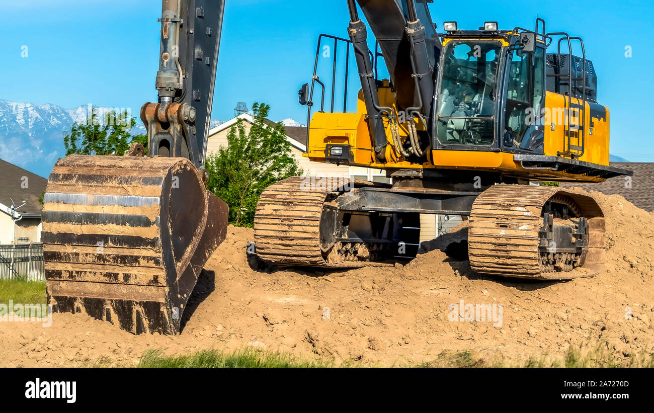 Panorama frame Close up of an excavator with arm bucket and continuous ...