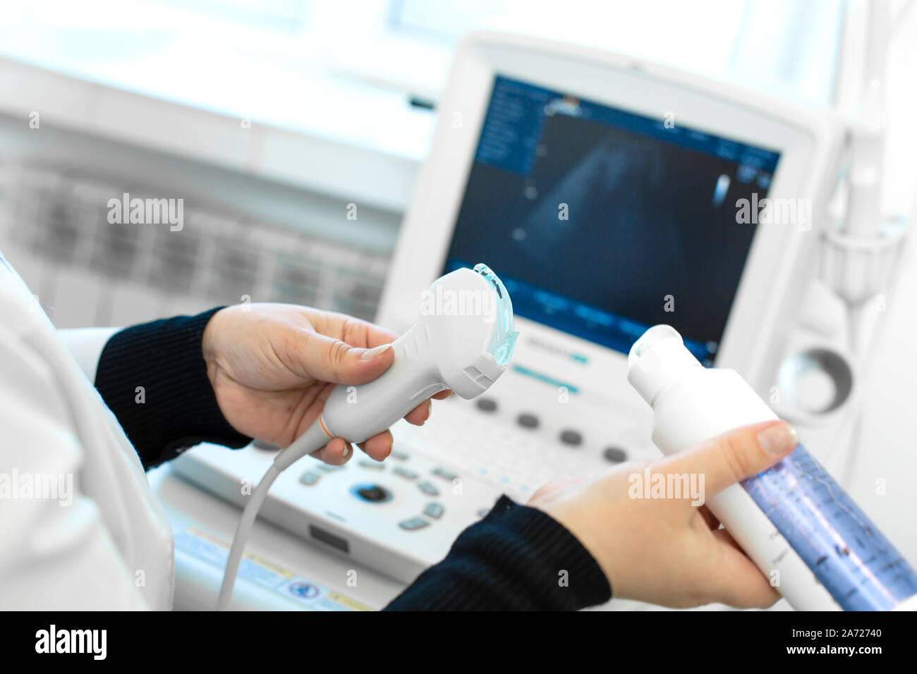 Doctor prepare an ultrasound machine for the diagnosis of a patient ...