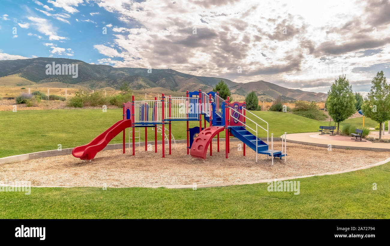 Panorama frame Fun childrens playground with amazing view of cloudy ...