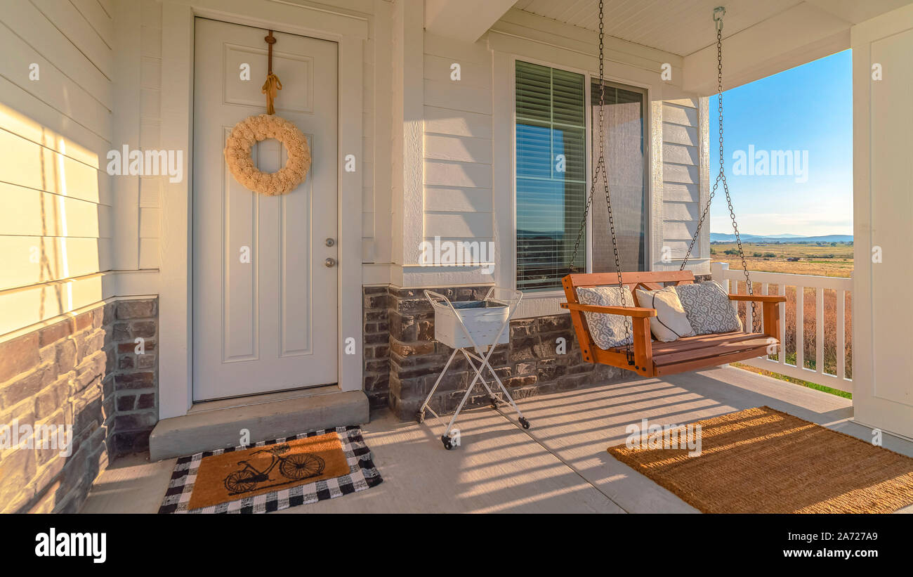 Panorama frame Front porch of modern home with swinging chair Stock ...