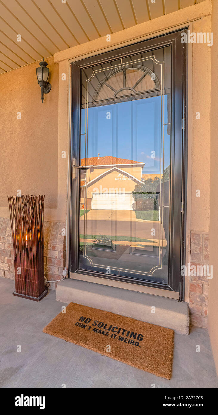 Vertical frame Front door and veranda of modern rendered home Stock ...