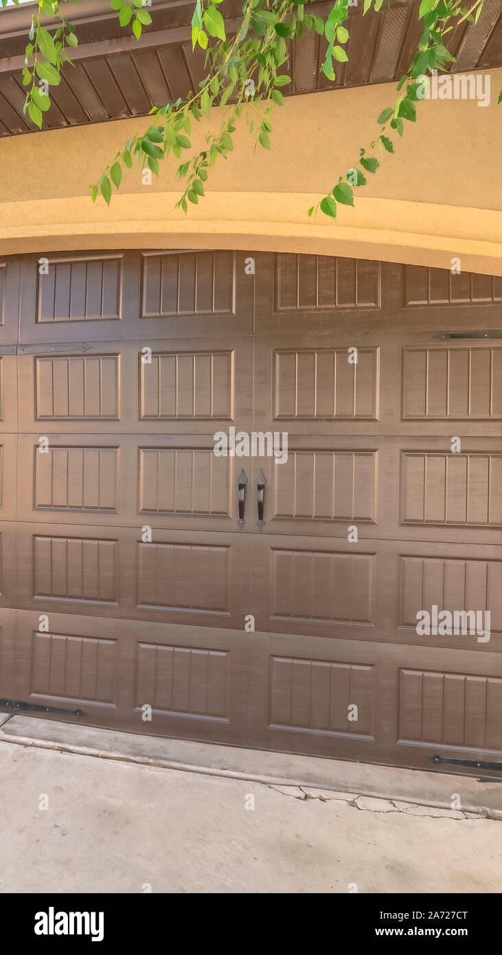 Vertical frame Garage door with an arched design against the concrete ...