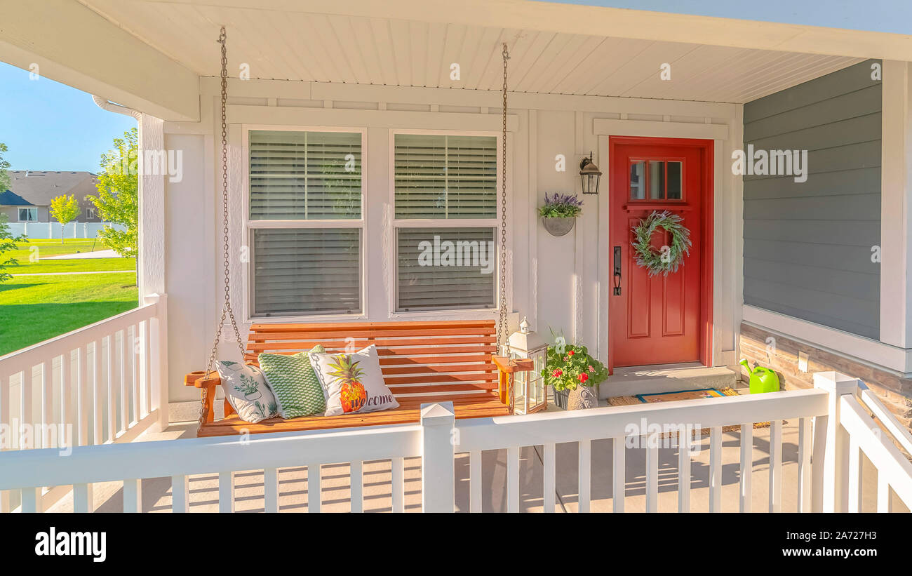Panorama frame Front porch of traditional home and swinging chair Stock ...