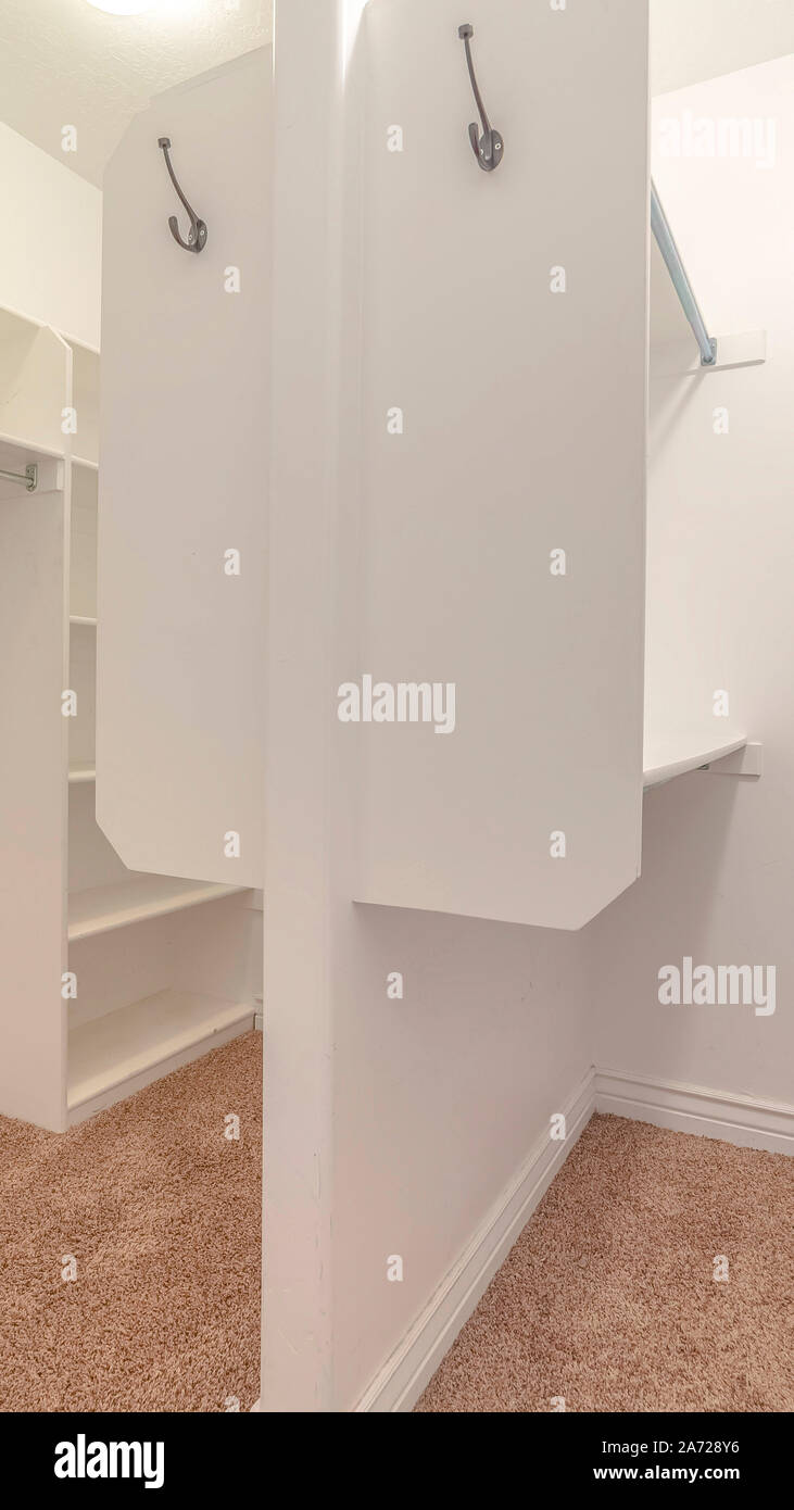 Vertical Interior of a dual walk in wardrobe Stock Photo - Alamy