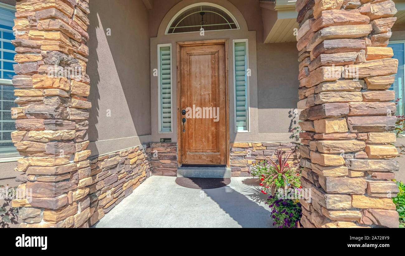Panorama frame Front porch and door of house with stone pillars Stock ...