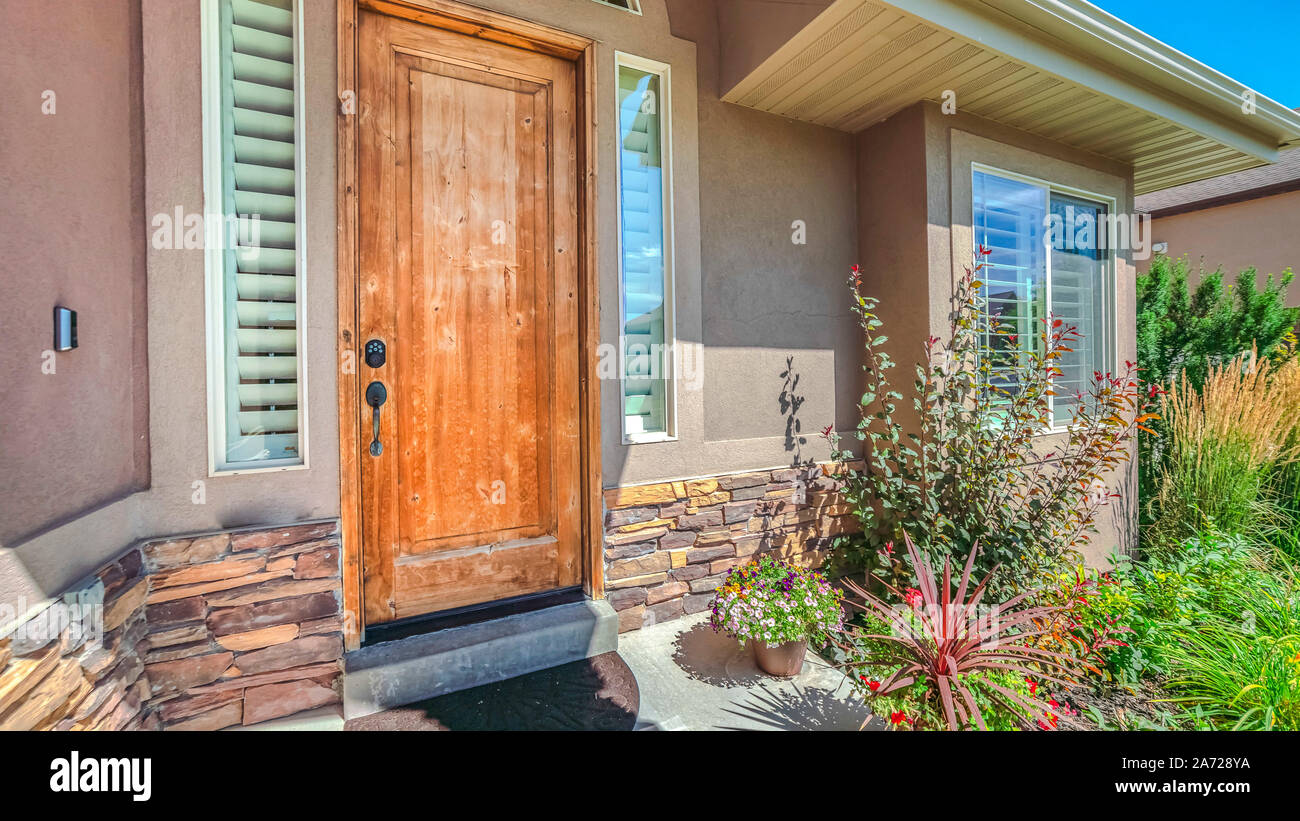 Panorama frame Front porch of house with wooden door and garden Stock ...