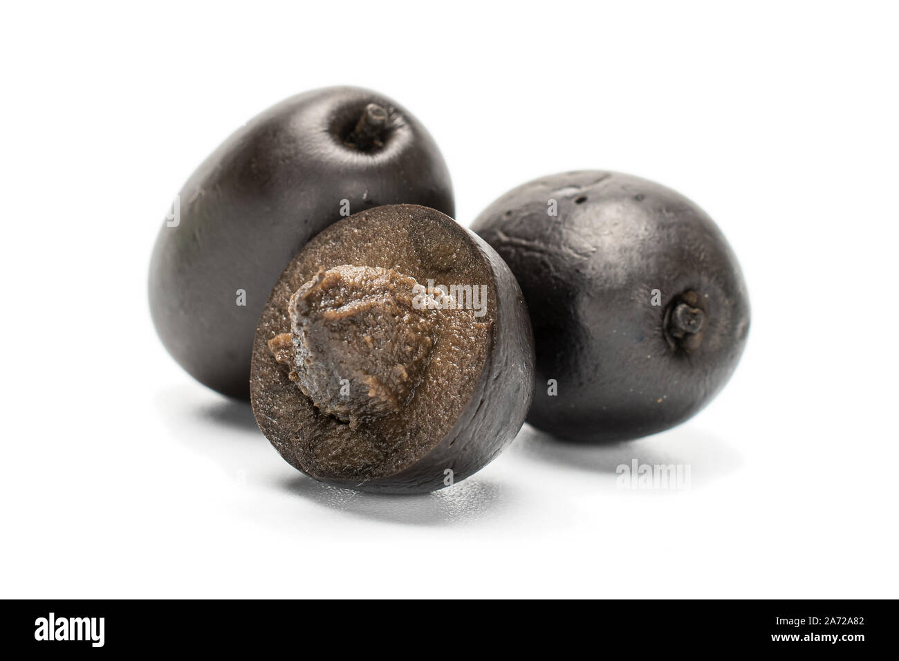 Group of two whole one half of canned black olive isolated on white ...