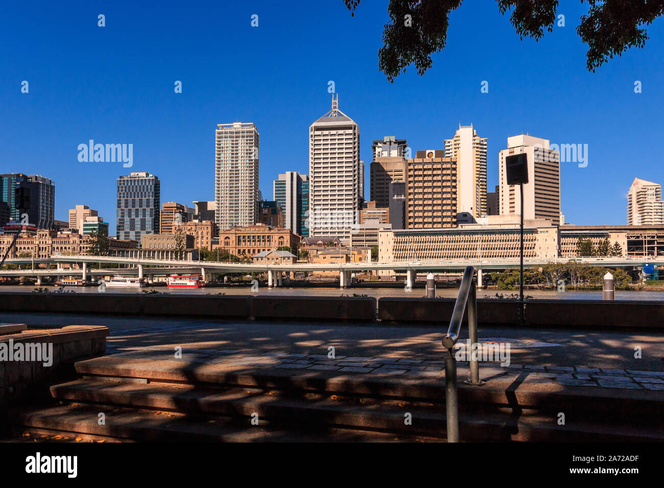 modern city view in a sunny day across the river, brisbane city ...