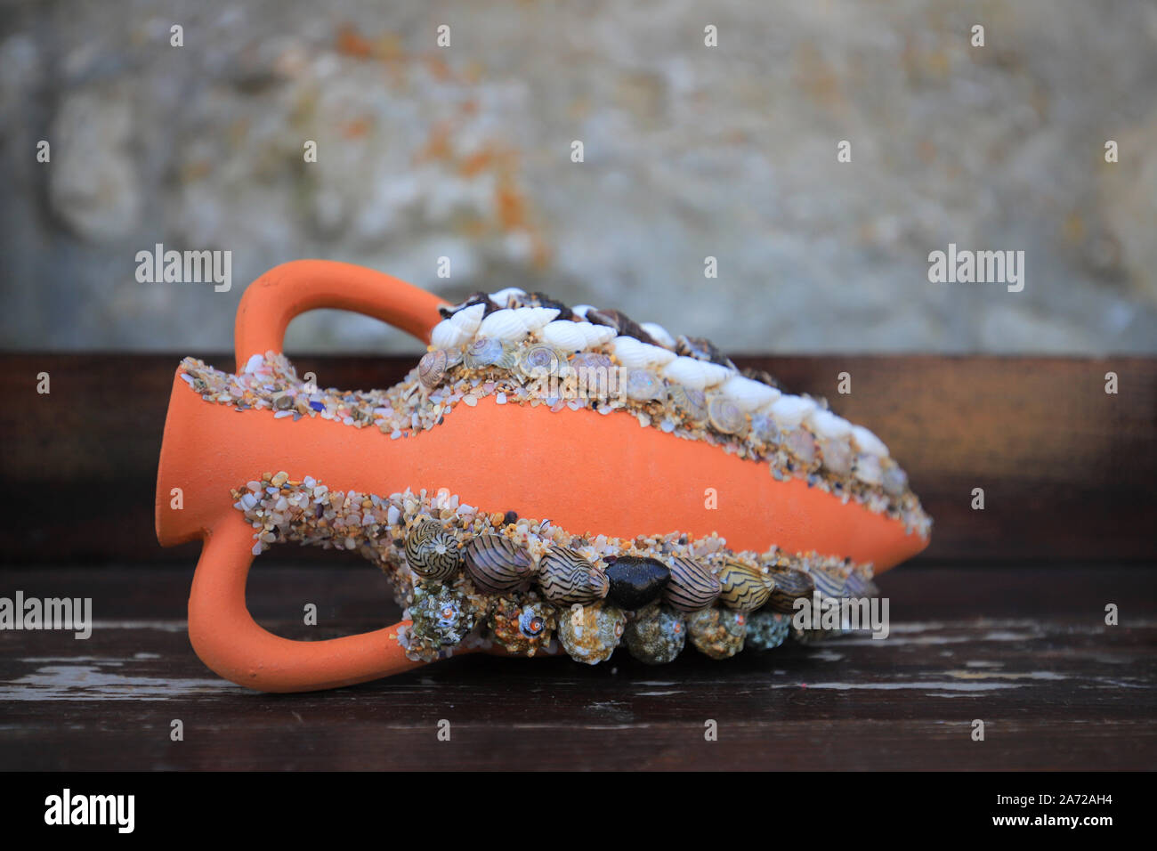 Souvenir ceramic jug with shell decorations close up Stock Photo - Alamy