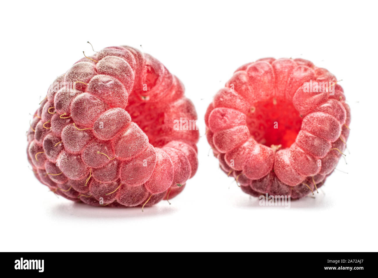 Group of three whole fresh crimson raspberry isolated on white ...