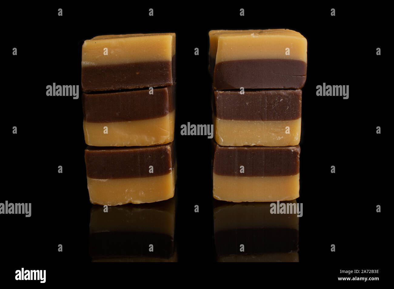 Group of six whole sweet brown caramel chocolate candy in two columns ...