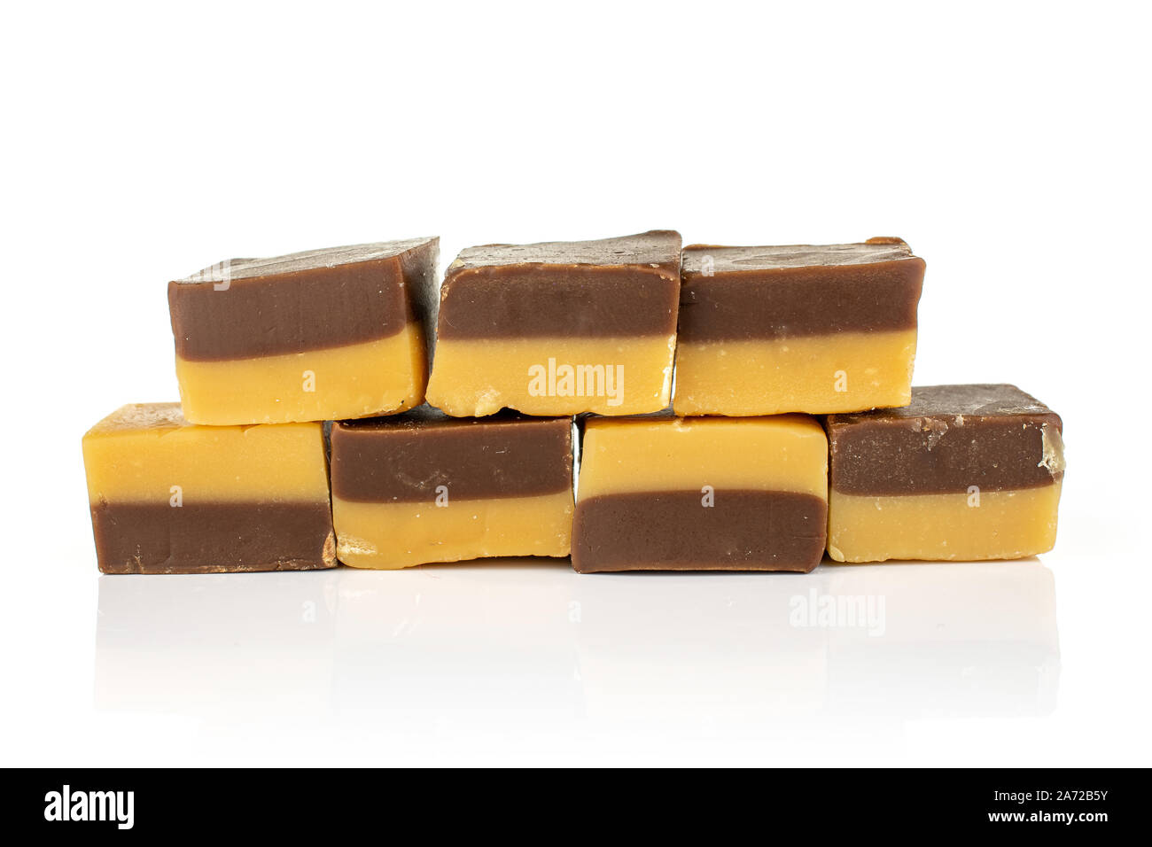 Group of seven whole sweet brown caramel chocolate candy isolated on ...