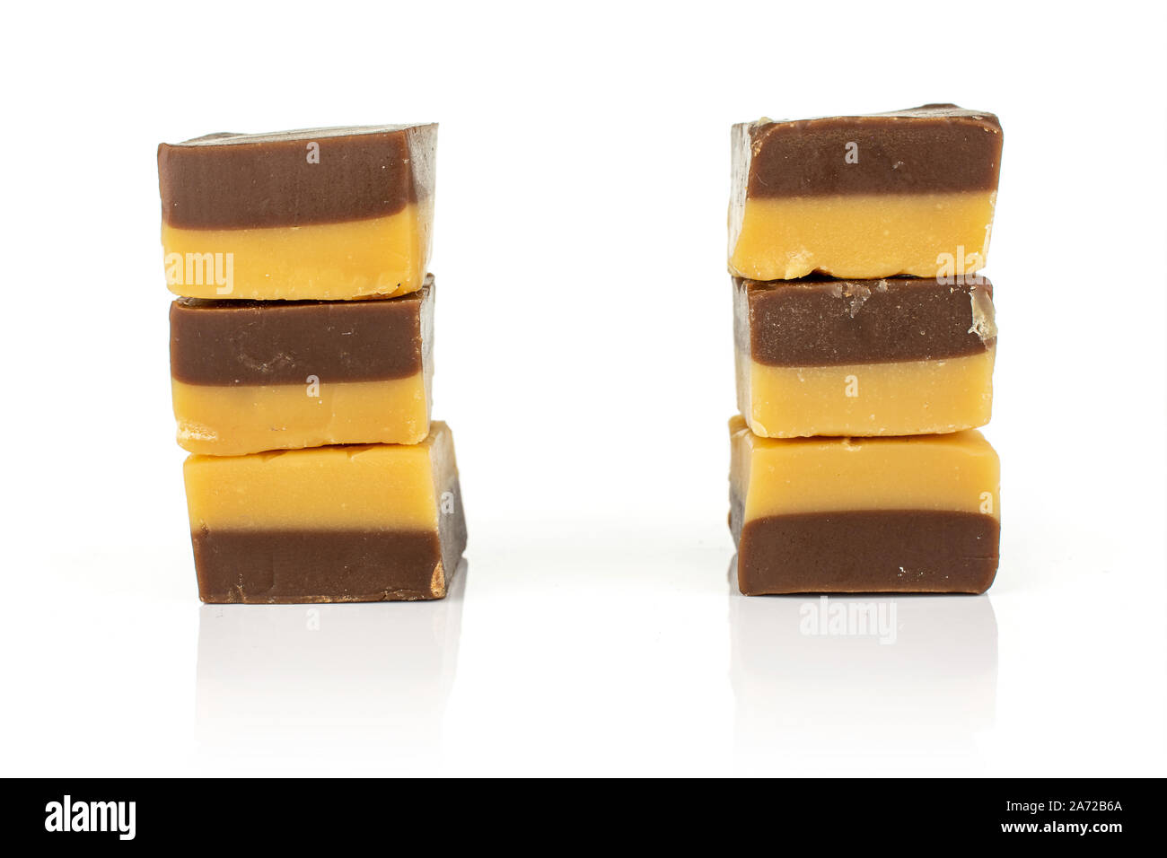 Group of six whole sweet brown caramel chocolate candy in two columns ...