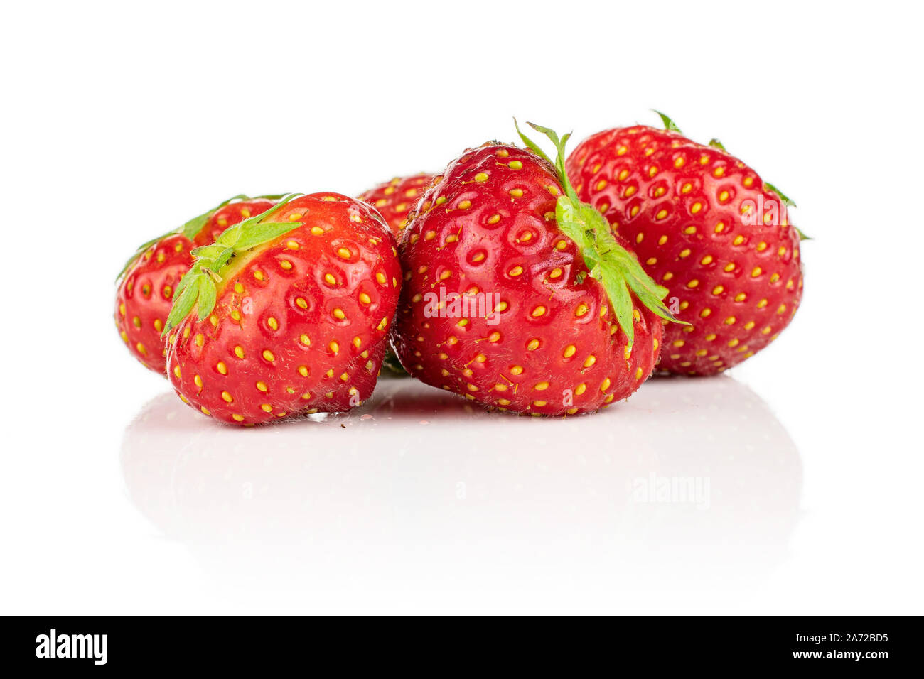 Group of five whole fresh red strawberry isolated on white background ...