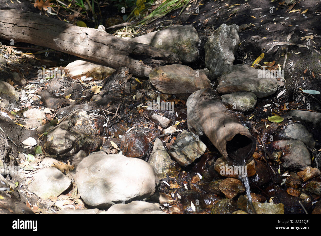Water Running through a Log Stock Photo - Alamy