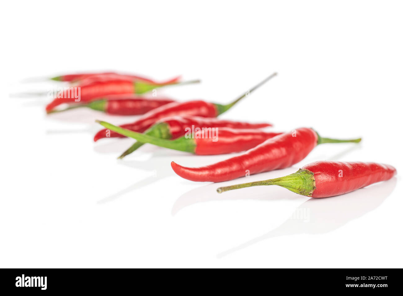 Lot of whole hot red chili diagonal isolated on white background Stock ...