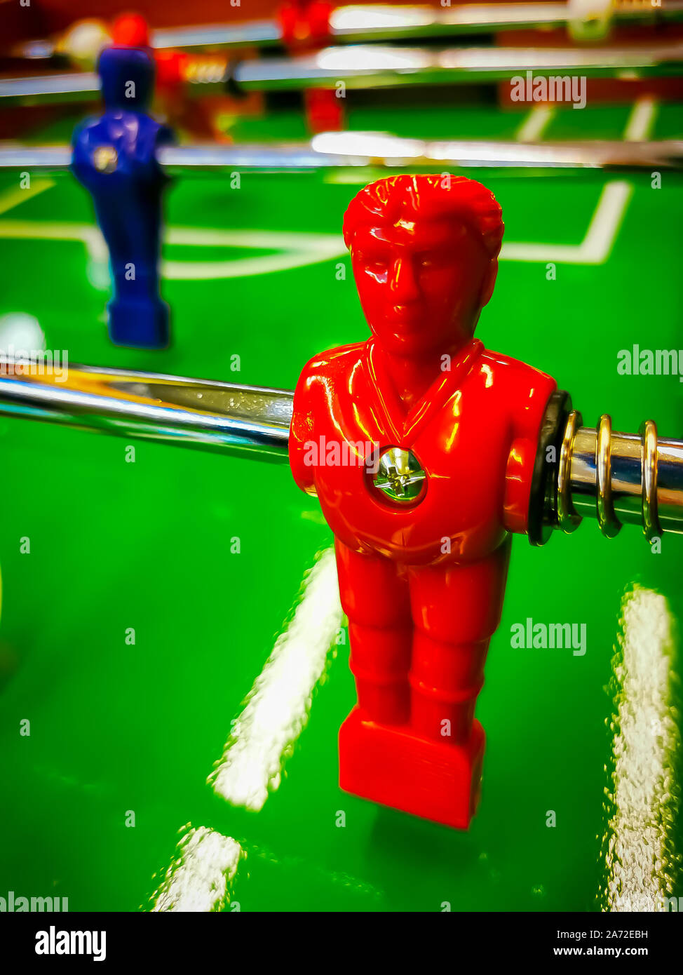 Foosball. Table with red and blue players detail perspective Stock ...