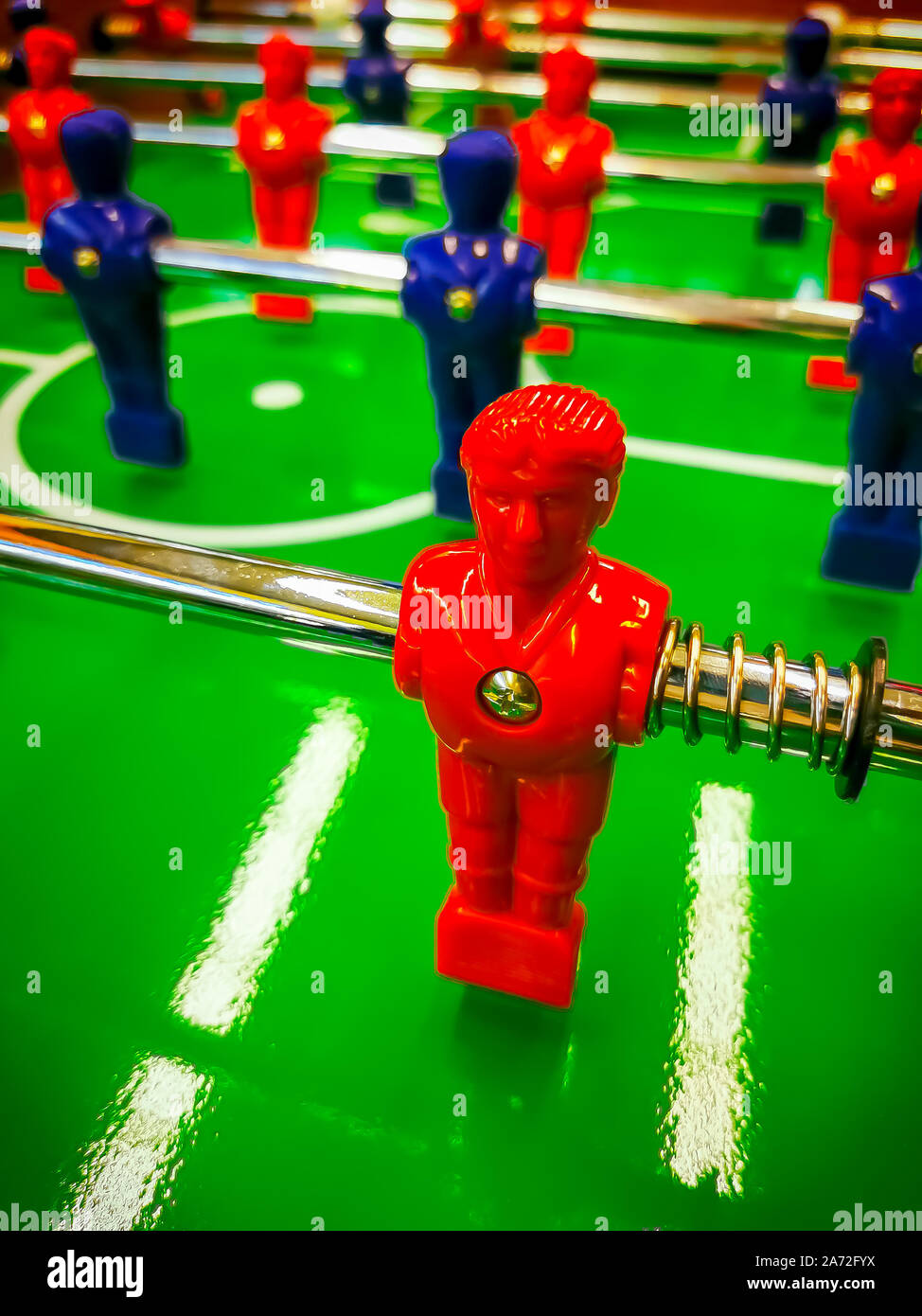 Foosball. Table with red and blue players detail perspective Stock ...