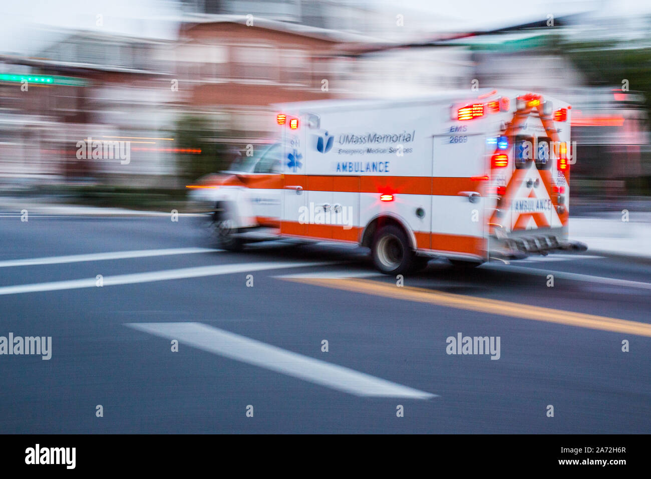 An ambulance speeding down Highland Street in Worcester, MA Stock Photo ...
