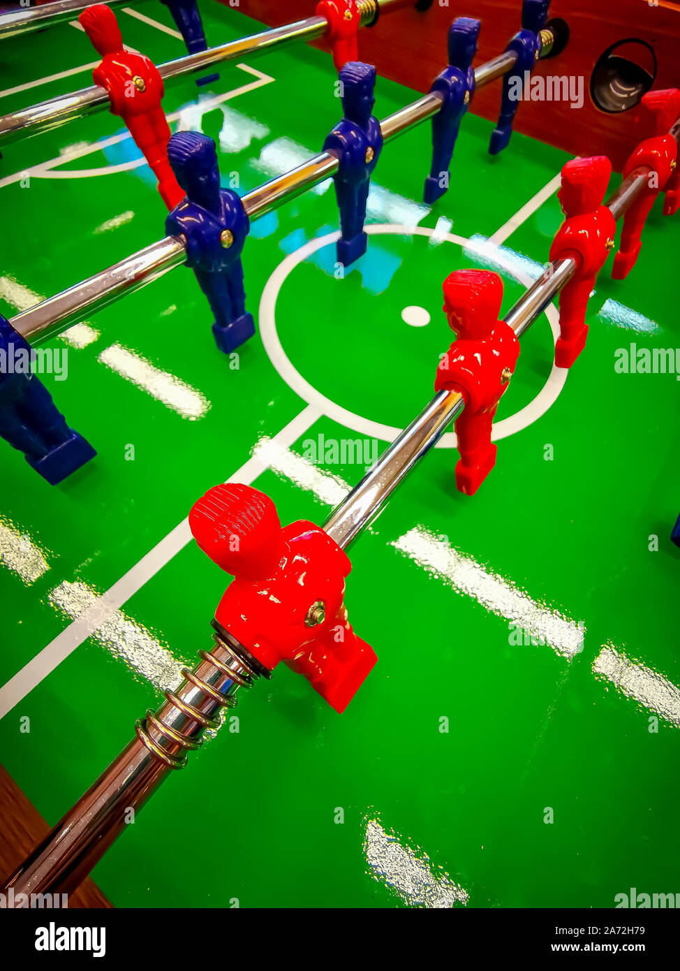 Foosball. Table with red and blue players detail perspective Stock ...