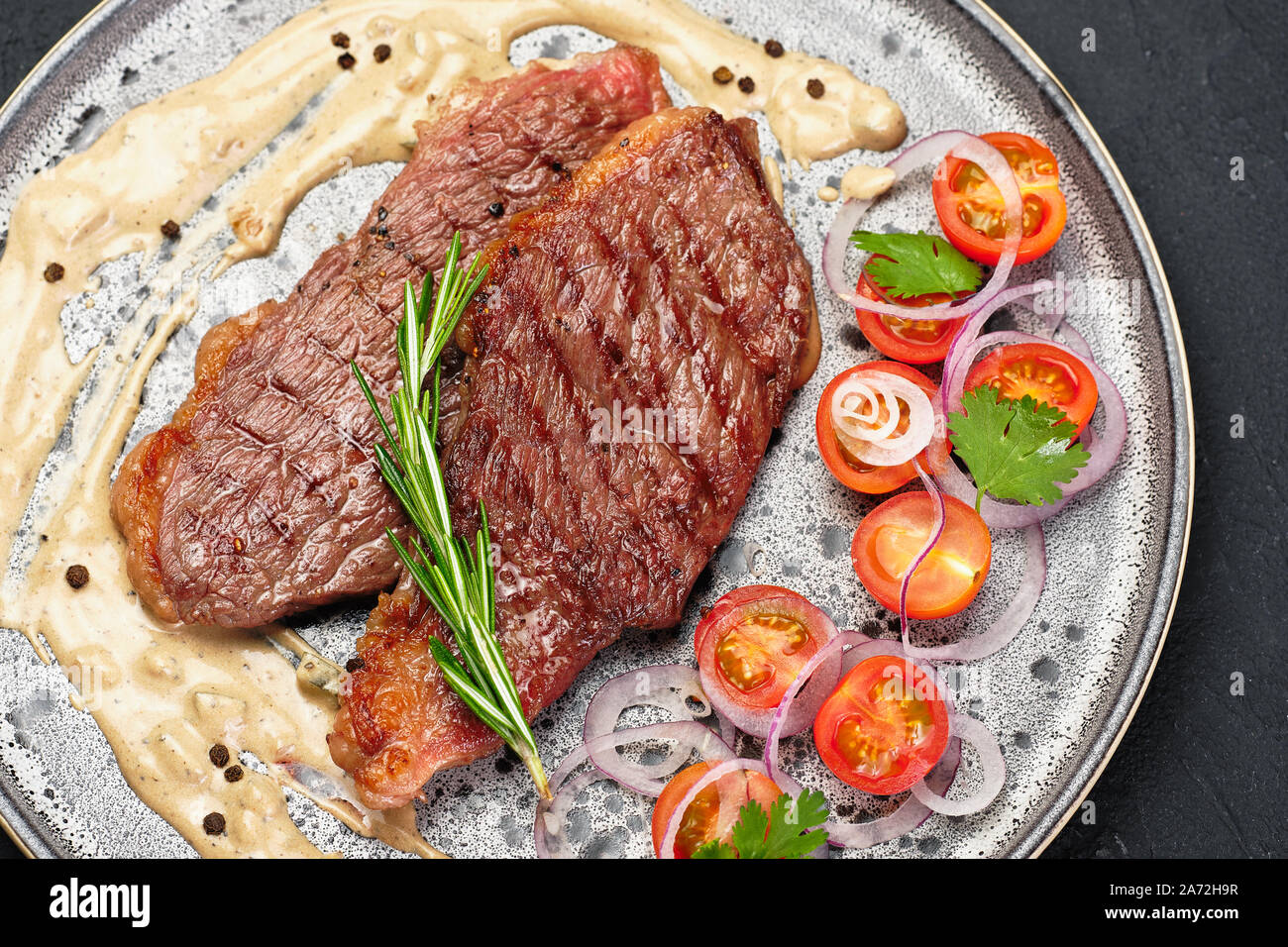 Fresh Cooked Meat on Metallic Plate Sliced Tomato Stock Photo - Alamy