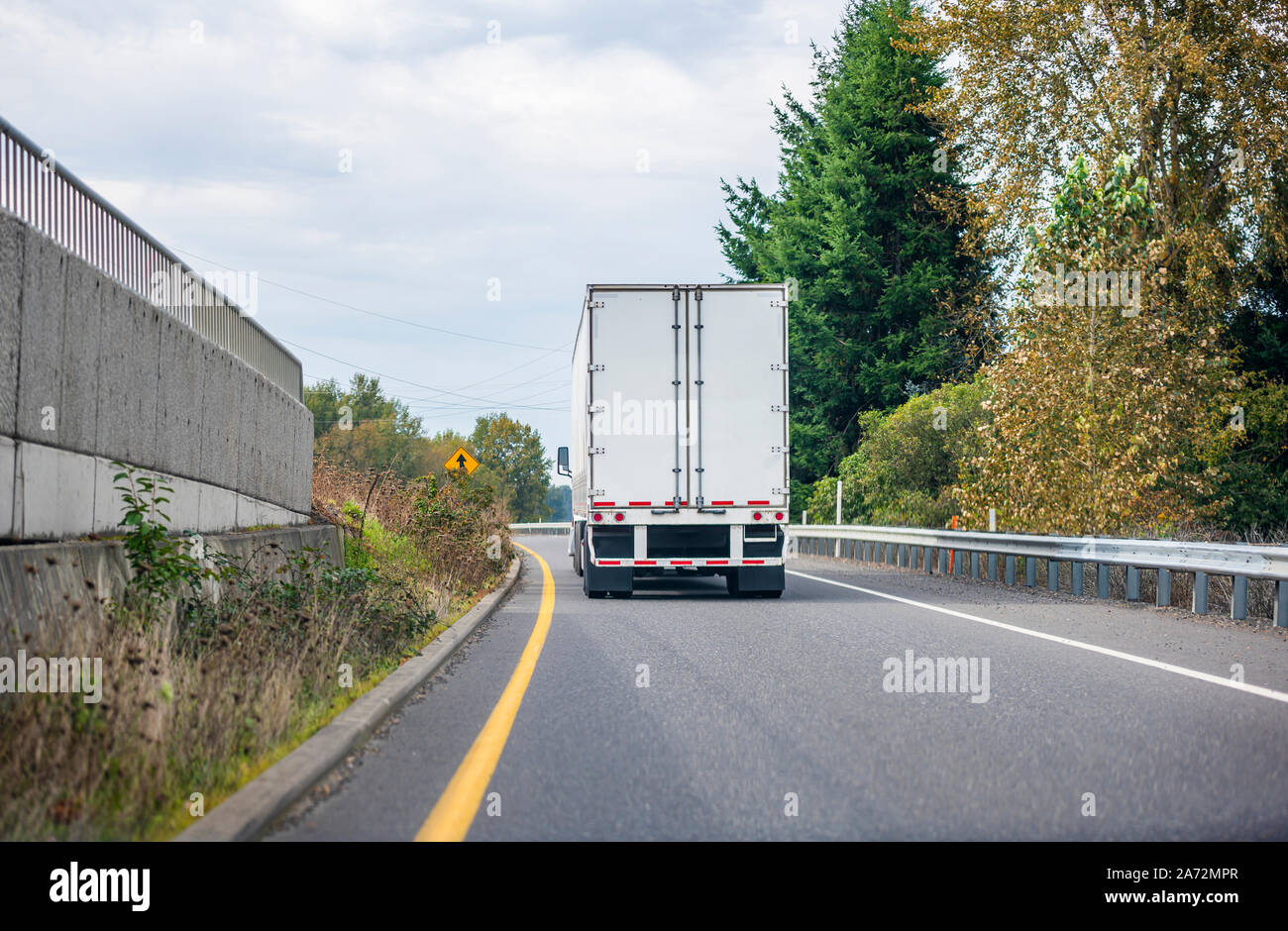 Big rig white day cab semi truck for local deliveries transporting ...