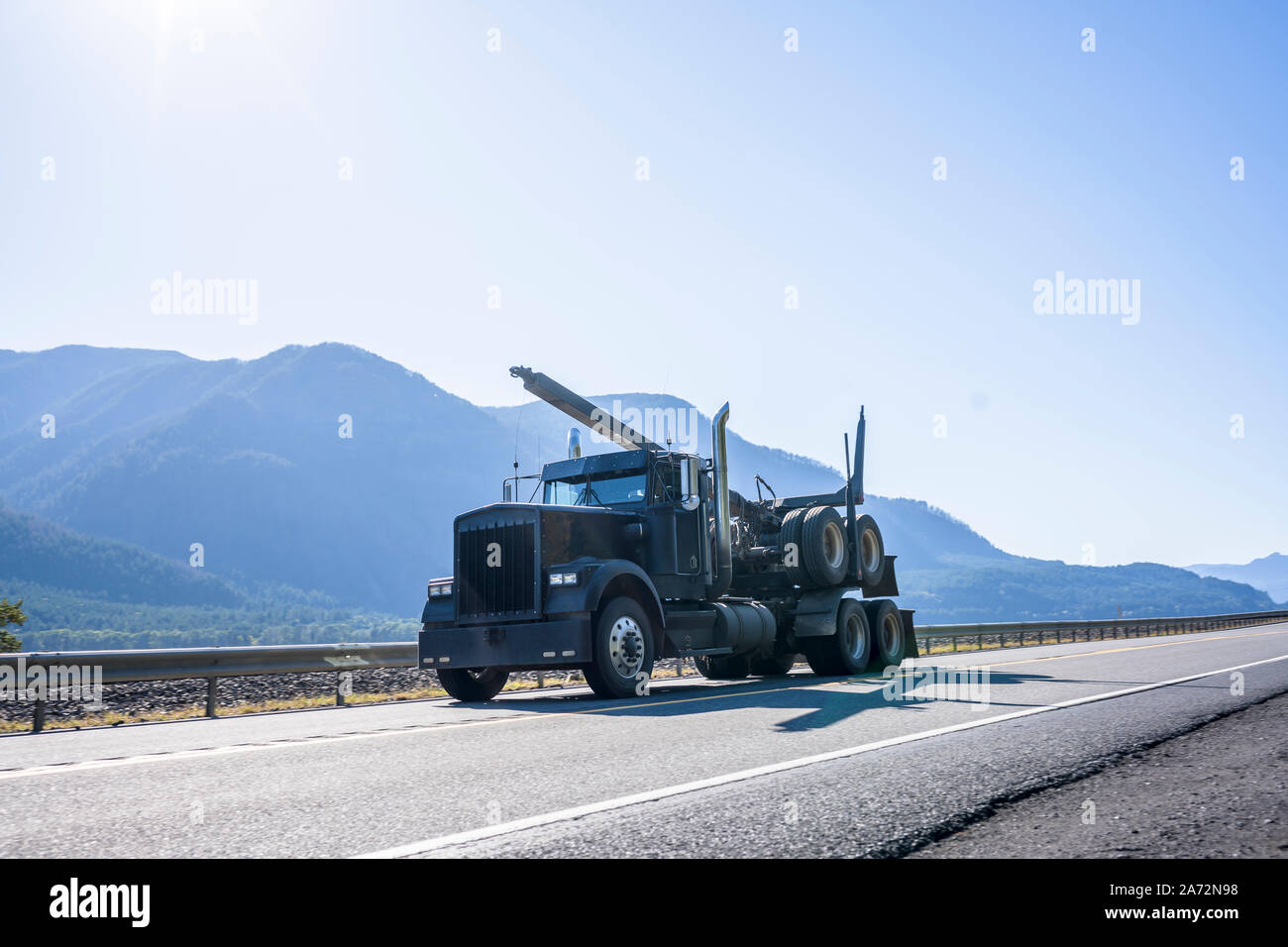 Black classic American bonnet big rig powerful semi truck with semi ...