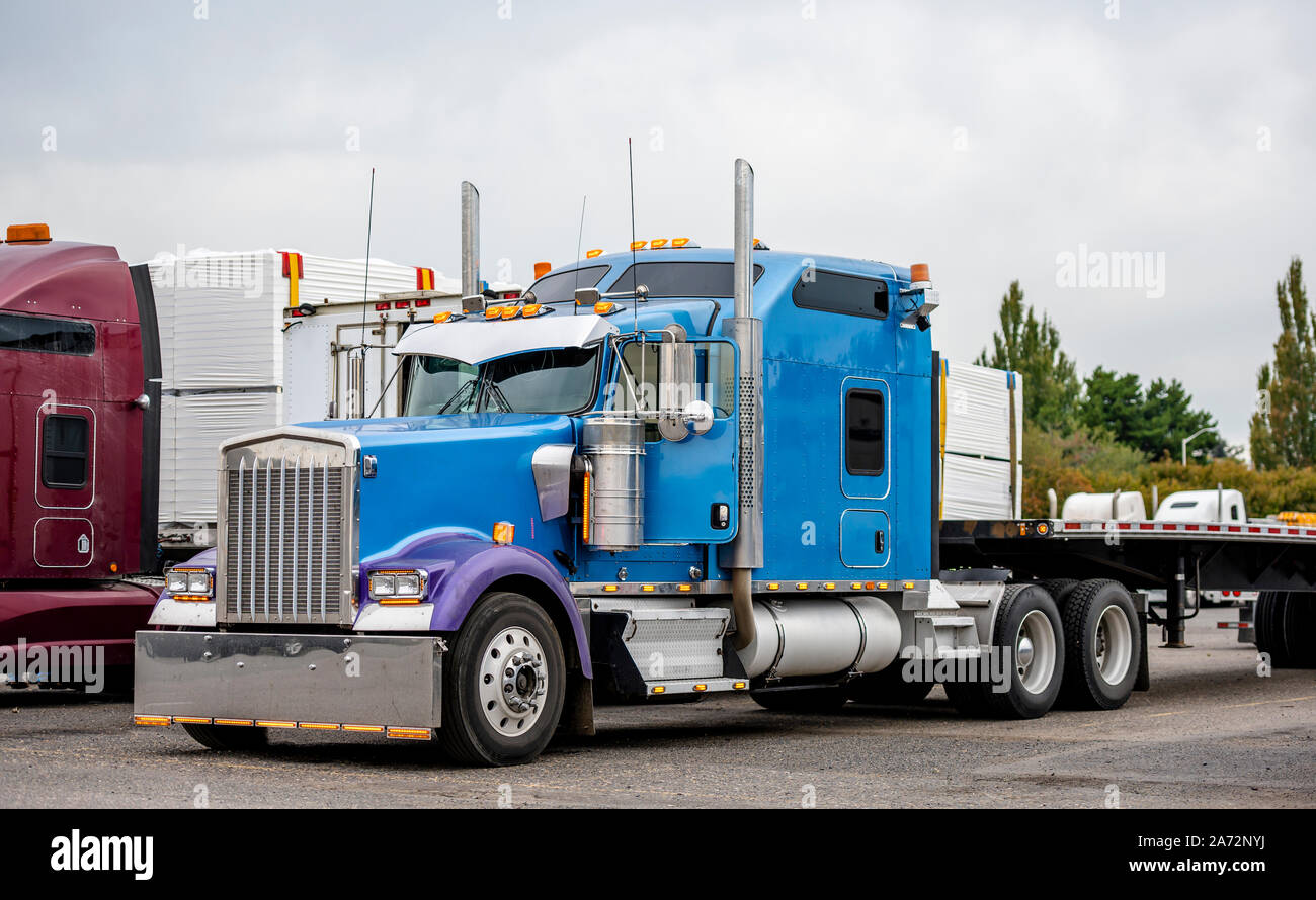 Classic big rig blue semi truck with long sleeping compartment and ...