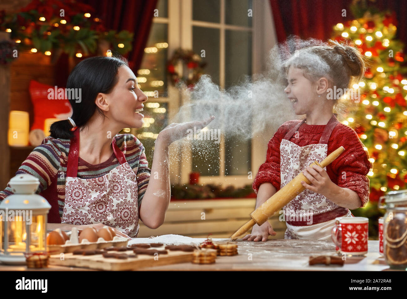 Merry Christmas and Happy Holidays. Family preparation holiday food ...