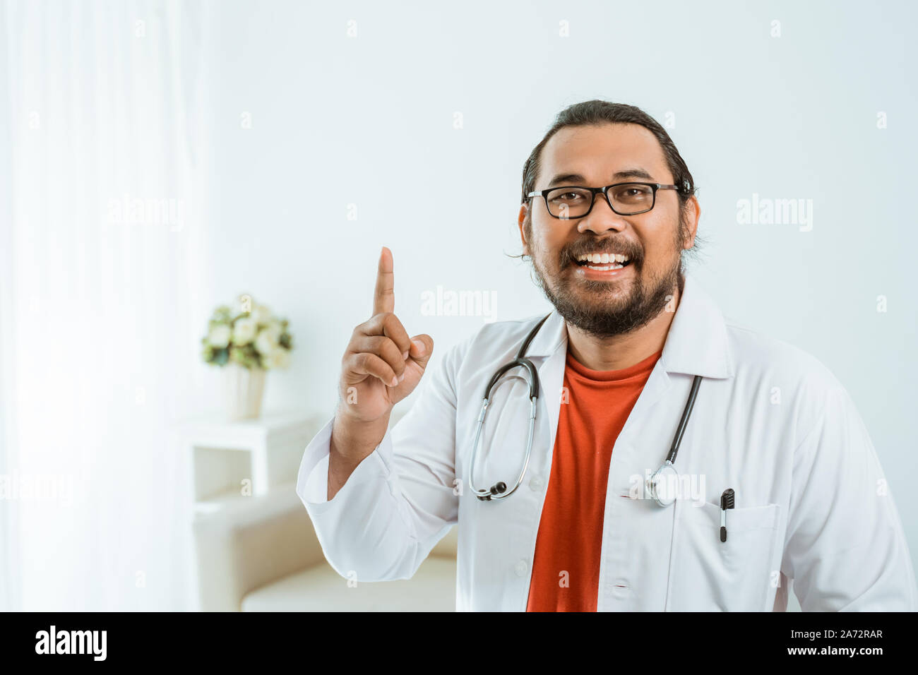 doctor pointing or showing one finger gesture to camera Stock Photo - Alamy