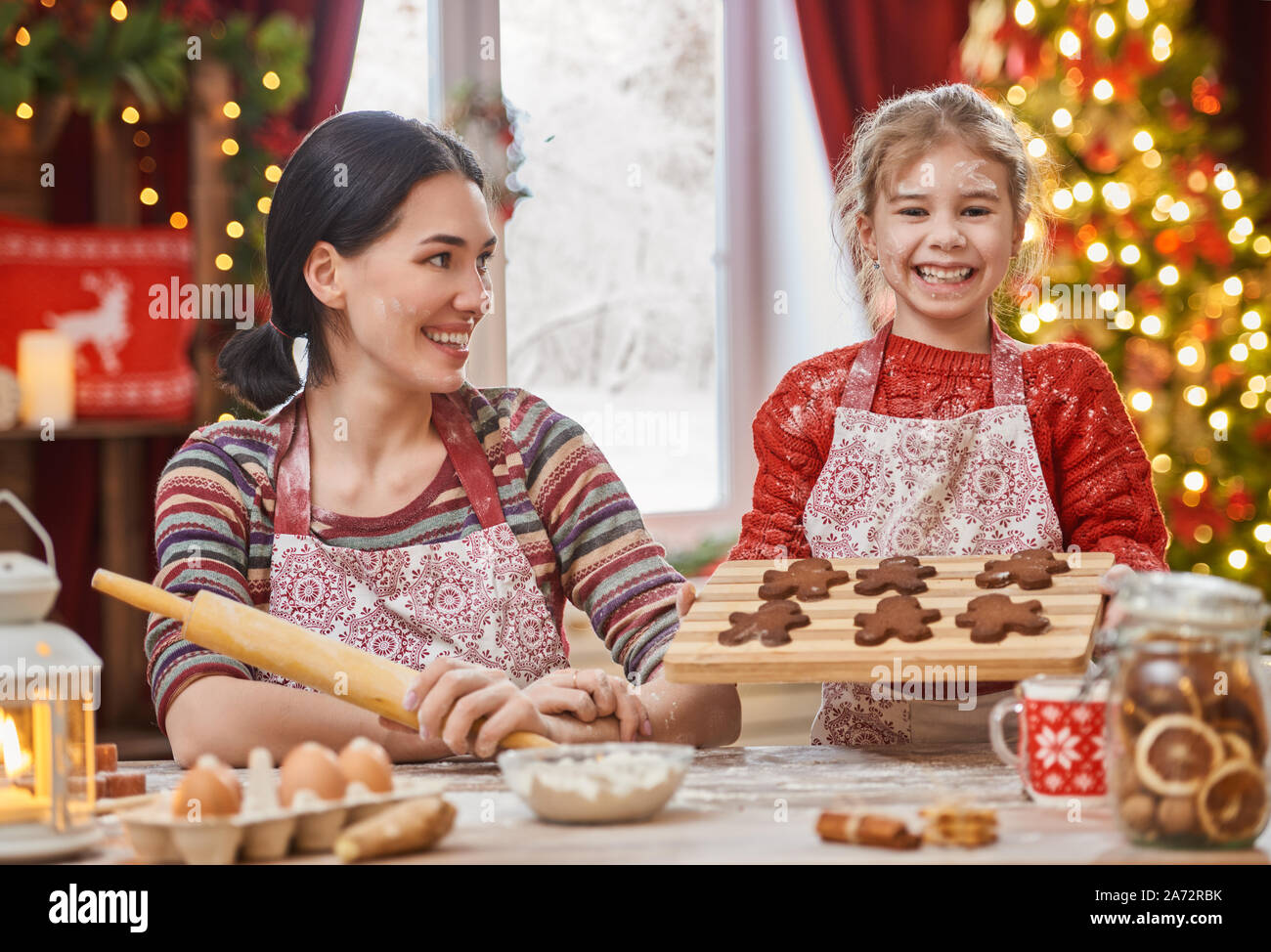 Merry Christmas and Happy Holidays. Family preparation holiday food ...