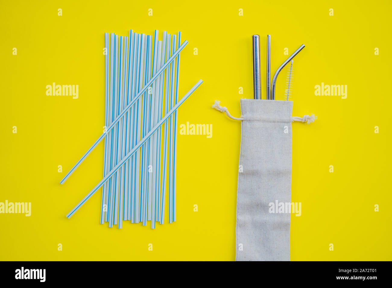 Steel drinking vs disposable straws on a yellow background. Zero waste ...