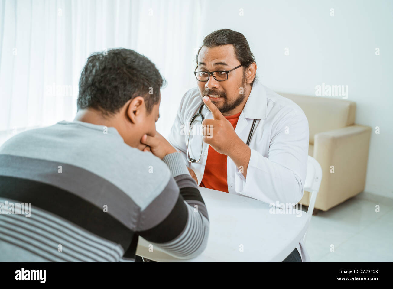 Angry pointing doctor hi-res stock photography and images - Alamy