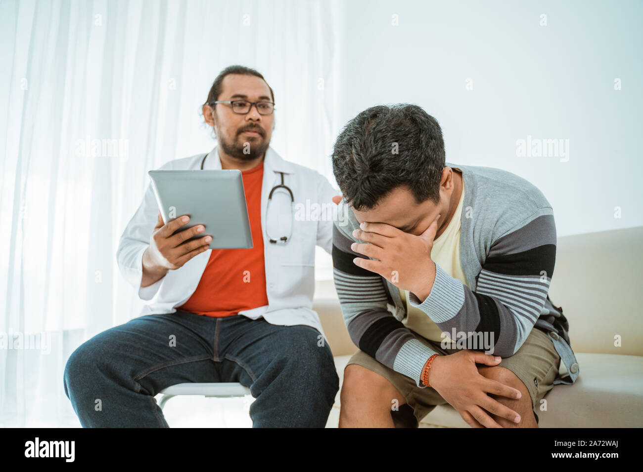 sad patient consultation with doctor try to comfort him Stock Photo - Alamy