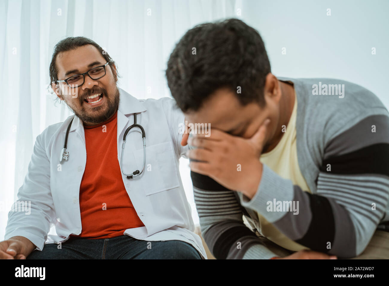 depress patient consulting with his doctor in his office Stock Photo ...