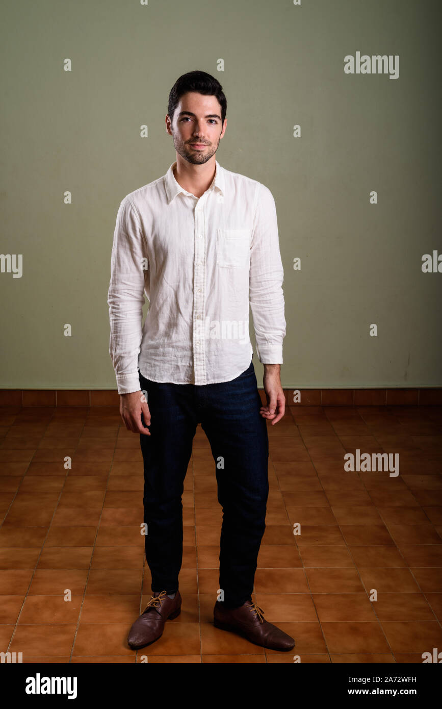 Full body shot of young handsome businessman with stubble beard Stock ...