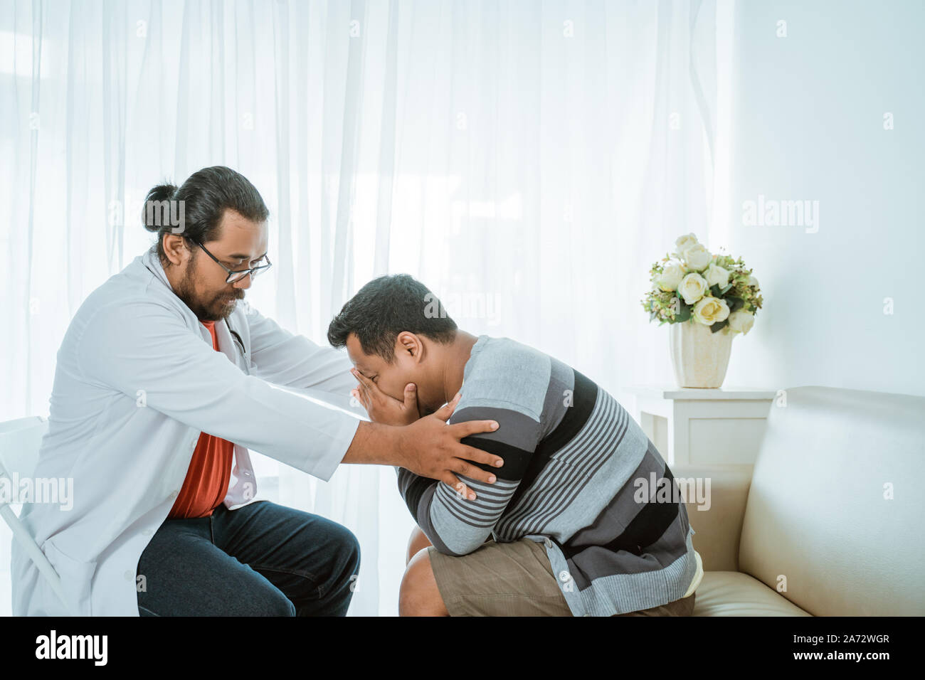 sad patient consultation with doctor try to comfort him Stock Photo - Alamy